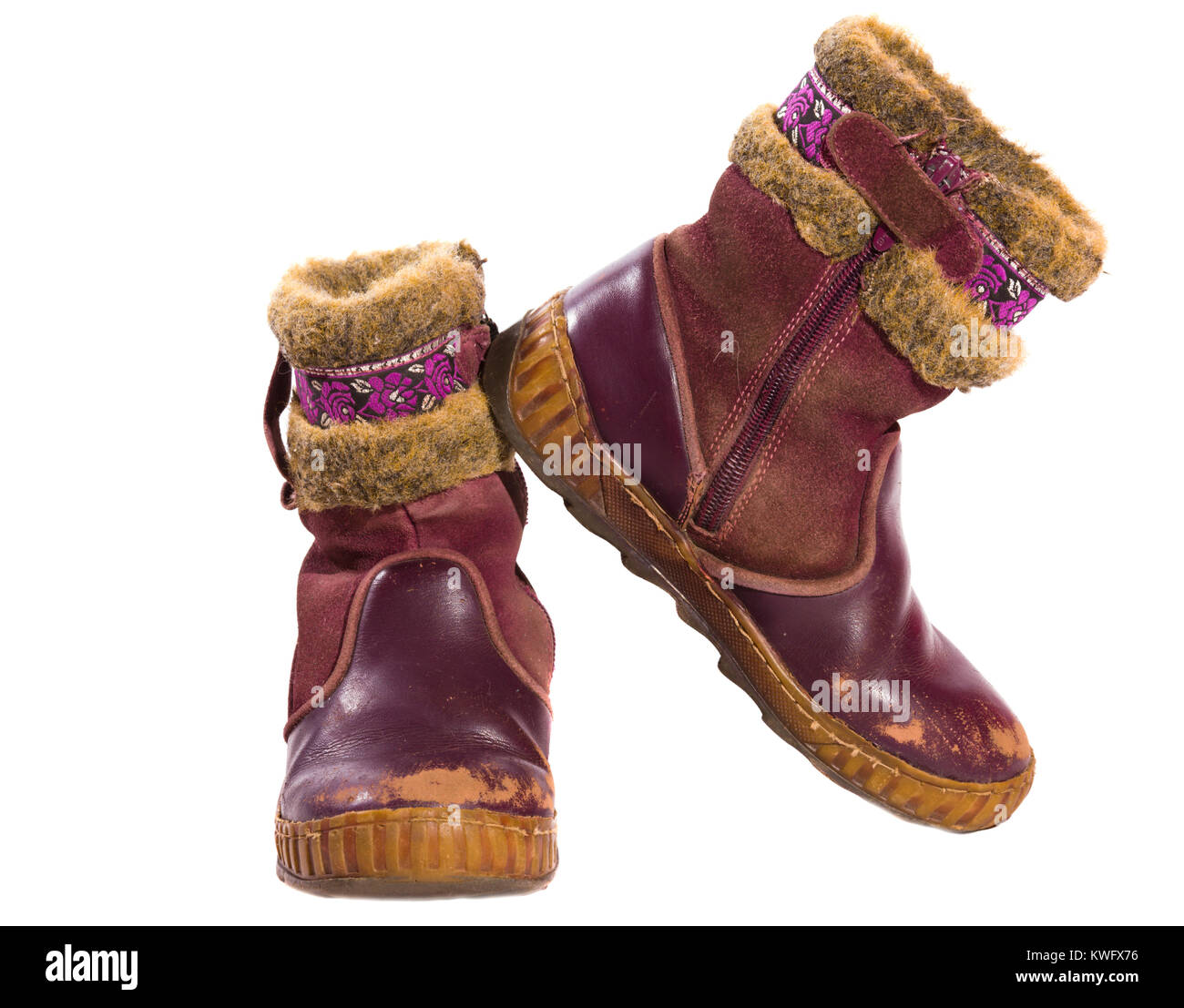Used old child shoes made of pieces of leather isolated on white Stock ...