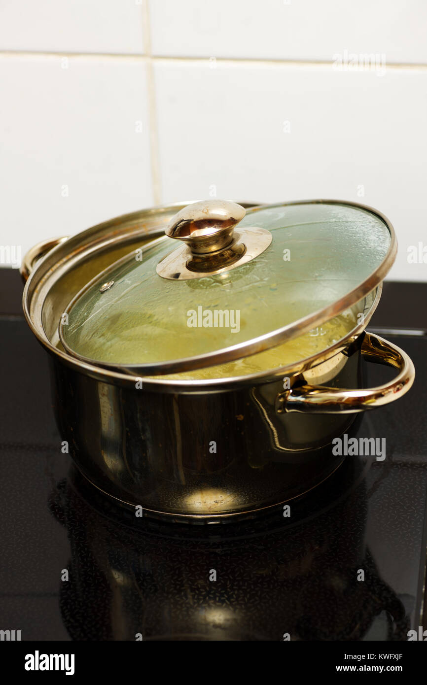 sausepan on electric stove with pasta in boiling water Stock Photo - Alamy