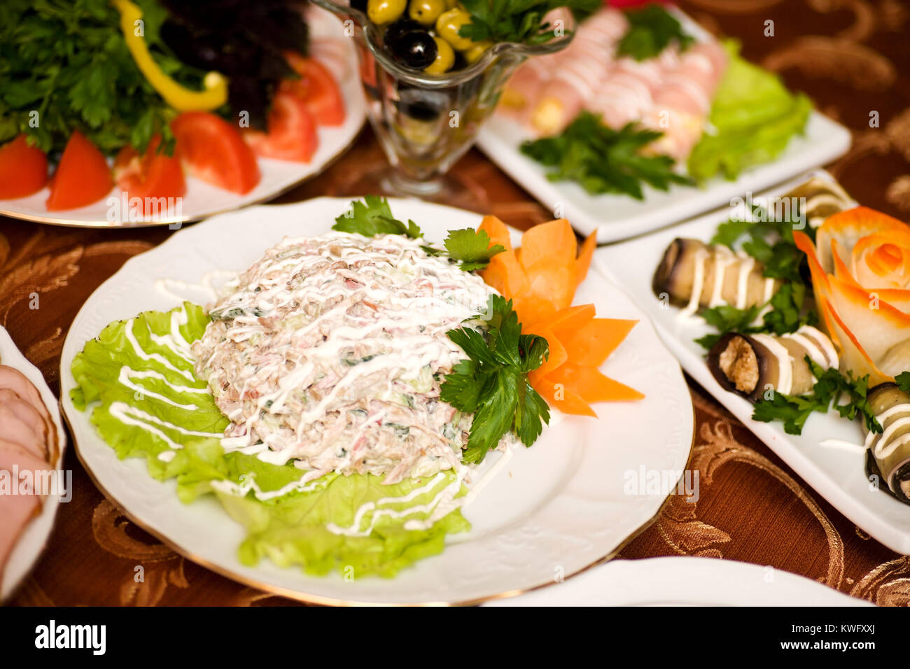 Salad closeup of full restaurant table Stock Photo - Alamy
