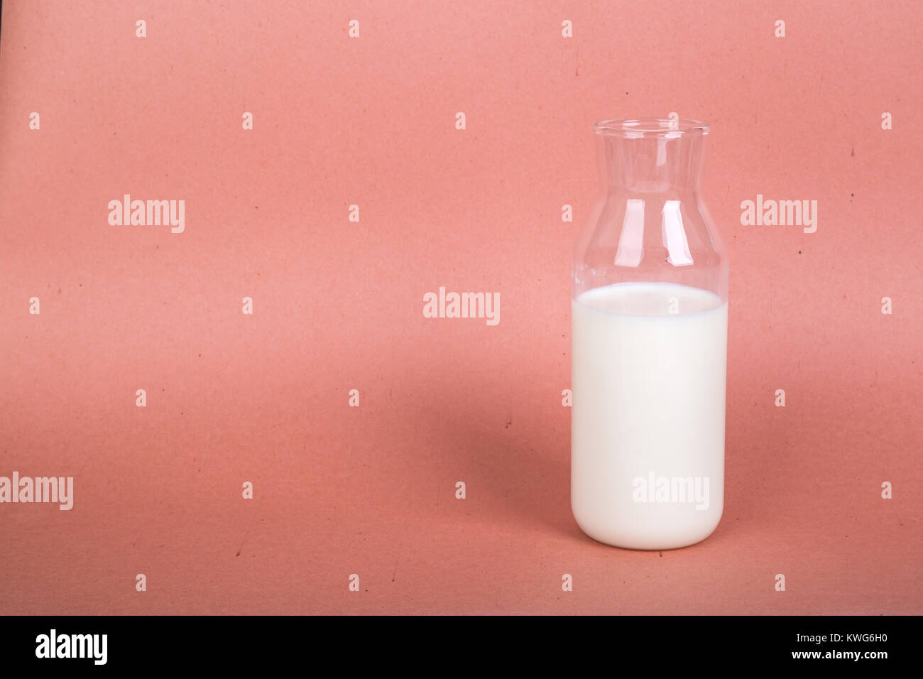 Single milk in bottle on light background Stock Photo - Alamy