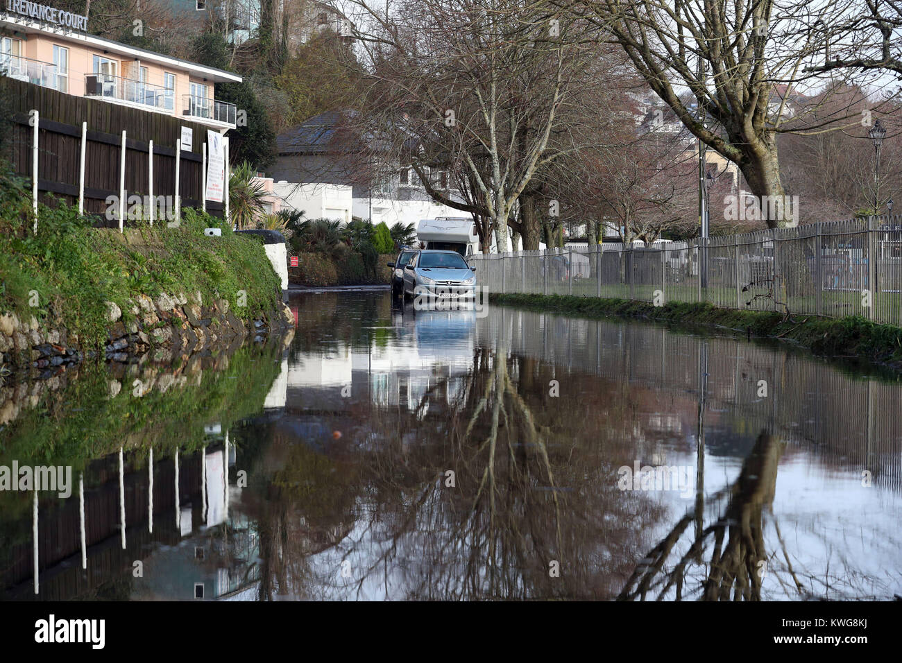 A car sits in flood water on a side road in Newquay, Cornwall, as Storm ...