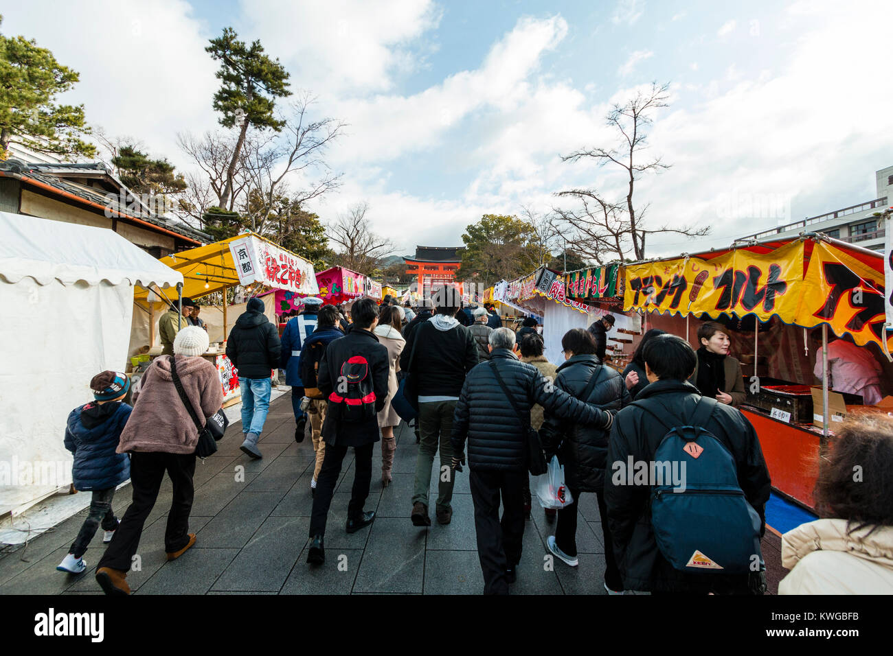 Japan, Kyoto, Fushimi Inari Taisha, New Year. Crowds of people heading ...