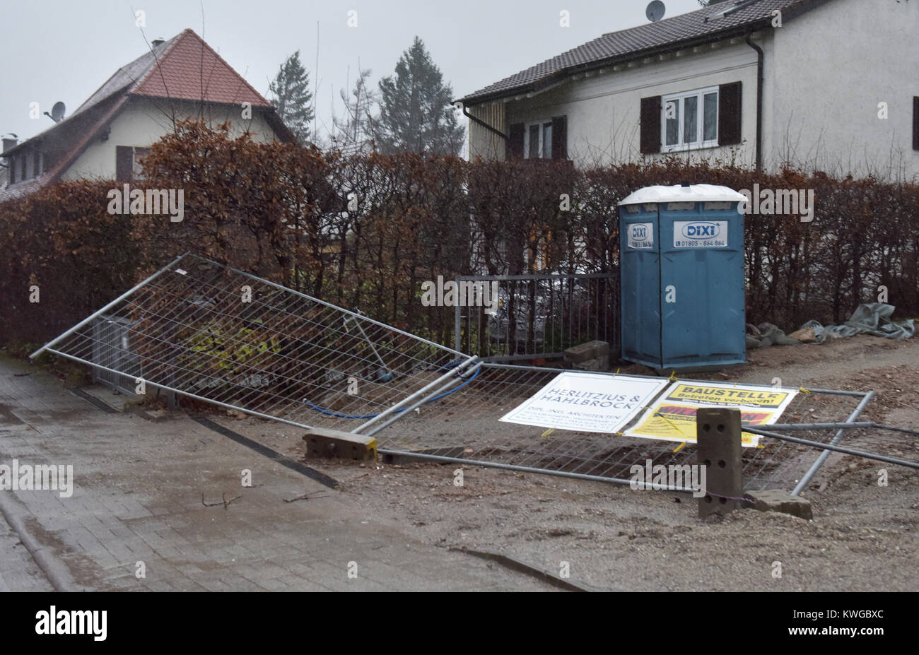 Kirchzarten, Germany. 03rd Jan, 2018. A site fence lies on the ground ...