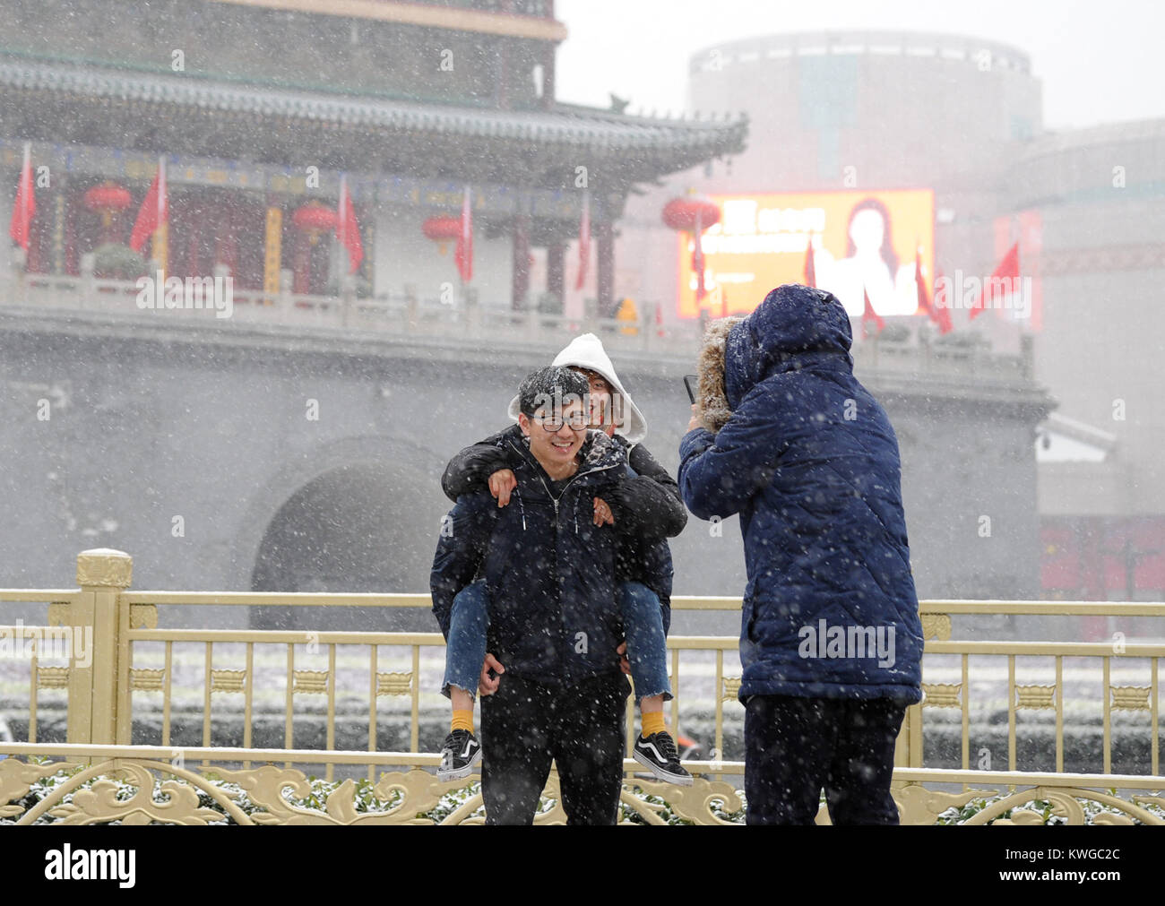 Xi'an, China's Shaanxi Province. 3rd Jan, 2018. People pose for a photo ...