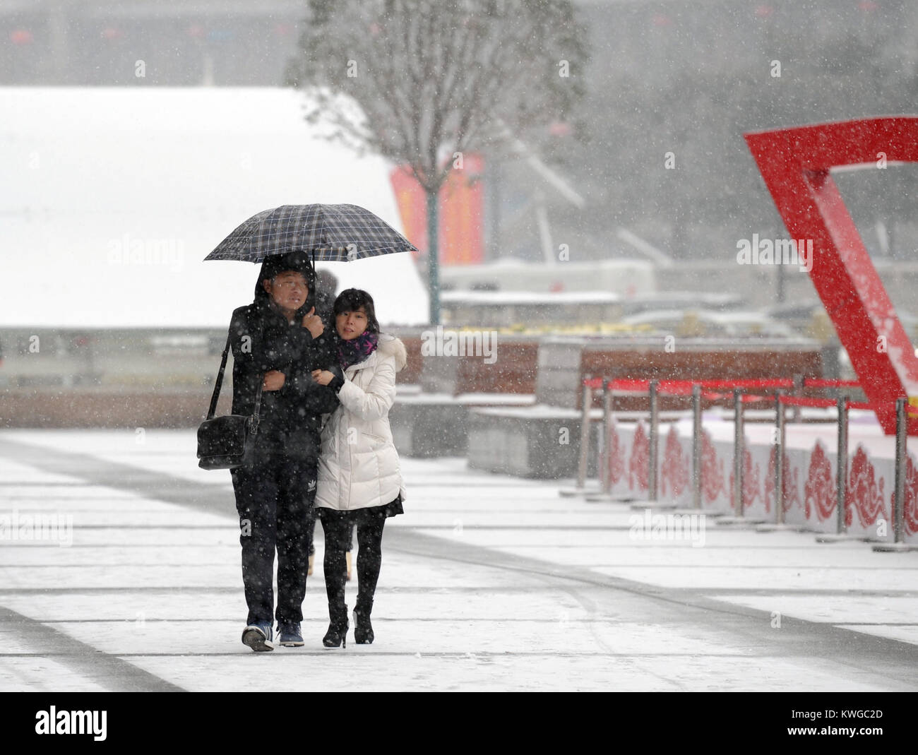 Xi'an, China's Shaanxi Province. 3rd Jan, 2018. People walk in snow in ...