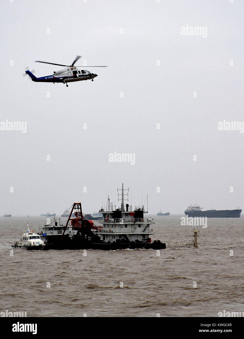 Shanghai. 3rd Jan, 2018. A ship and a helicopter search and rescue in ...