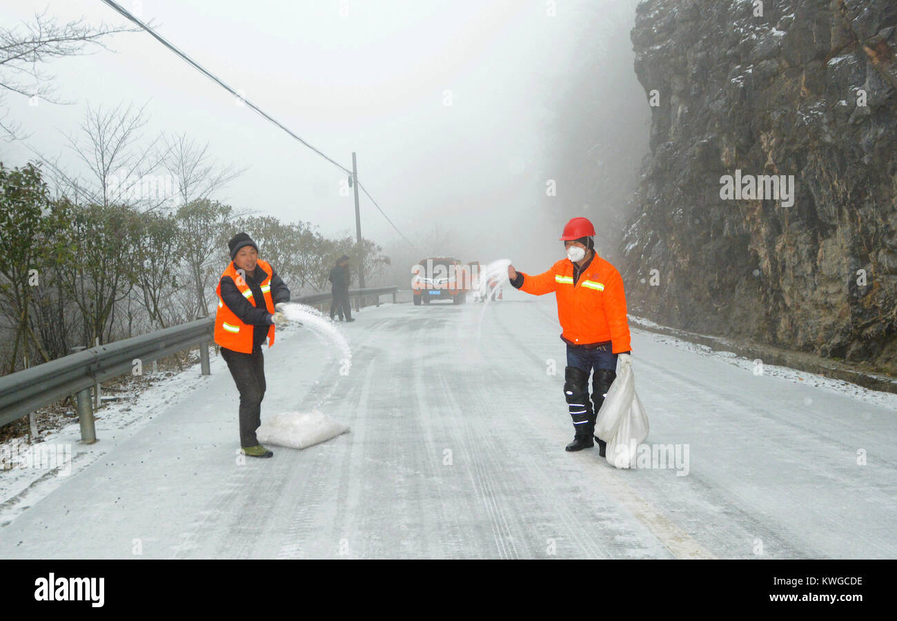 Xiangyang, China's Hubei Province. 3rd Jan, 2018. Workers spread snow ...