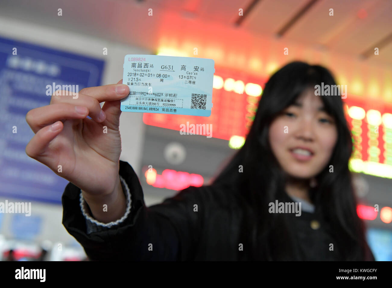 Nanchang, China's Jiangxi Province. 3rd Jan, 2018. A passenger shows a ...
