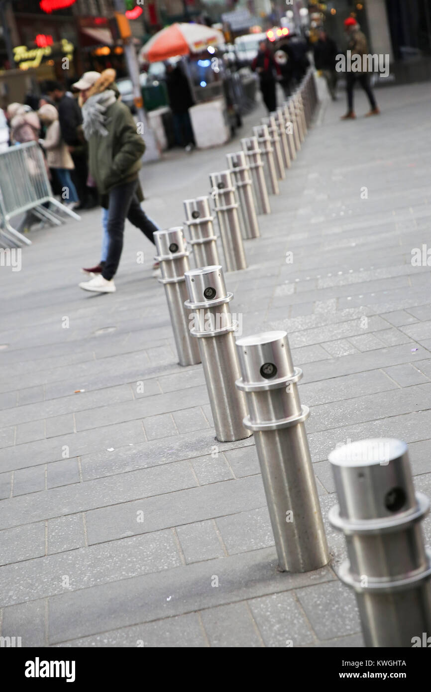 New York, USA. 3rd Jan, 2018. Pedestrians walk past metal bollards at ...