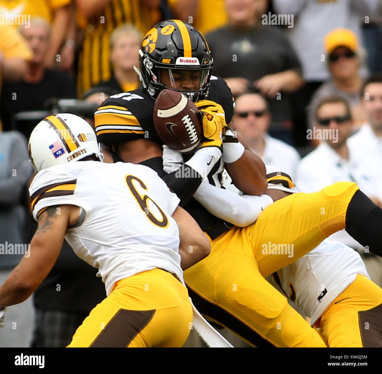 Iowa City, Iowa, USA. 1st Sep, 2017. Iowa's Noah Fant gets hit by ...