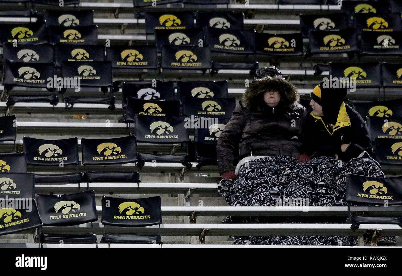 Iowa City, Iowa, USA. 18th Nov, 2017. Iowa Hawkeye fans sit bundled up ...