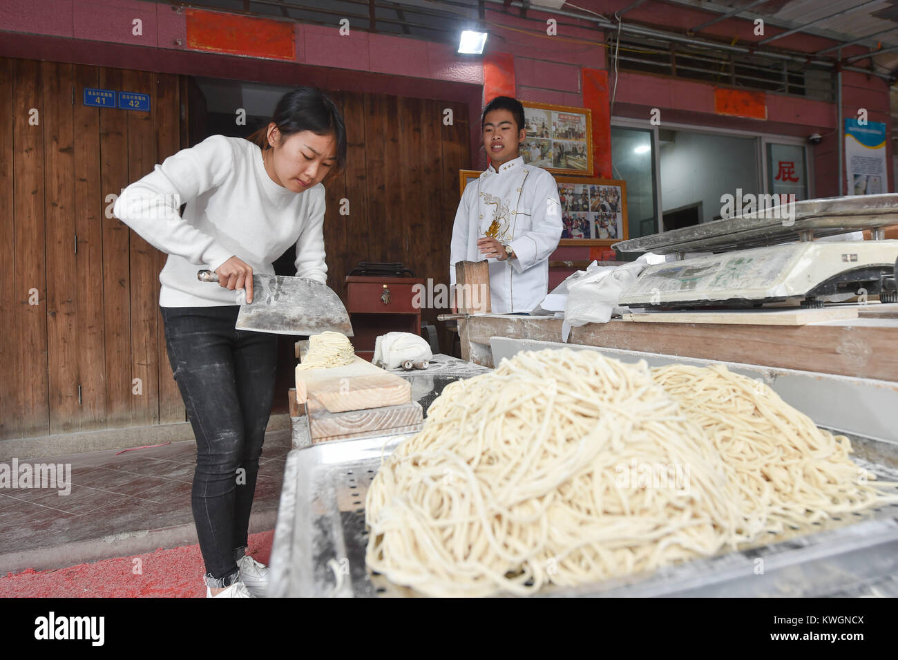 Nan'an, China's Fujian Province. 3rd Jan, 2018. Guo Weilan (L) makes ...
