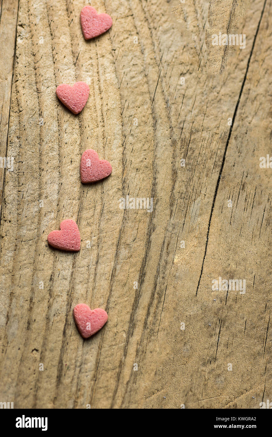 Border Frame from Pink Sugar Sprinkles Candies Scattered on Weathered ...
