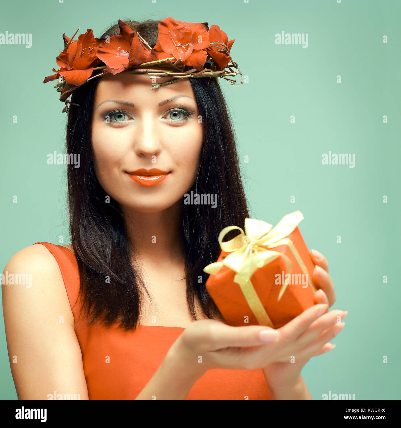 Beautiful fashion model with gift Stock Photo - Alamy
