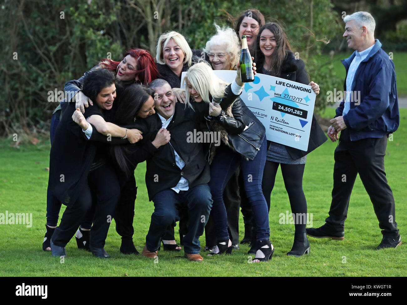 Taxi driver Amo Riselli, 50, with his family during a photocall at ...