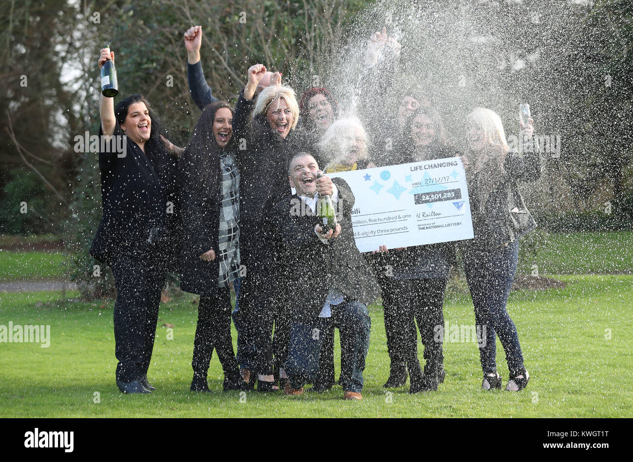 Taxi driver Amo Riselli, 50, with his family during a photocall at ...