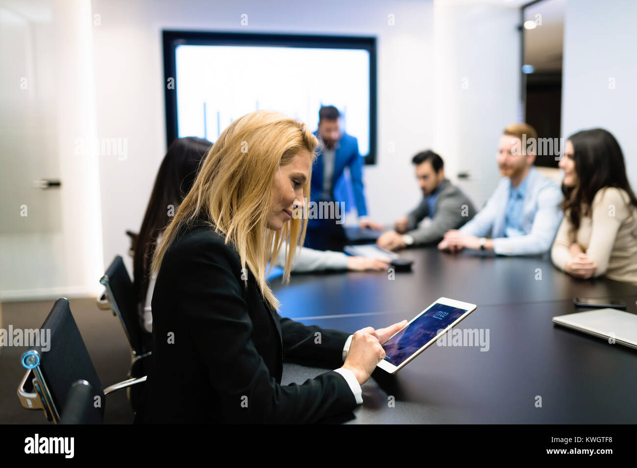 Portrait of beautiful businesswoman in conference room Stock Photo - Alamy