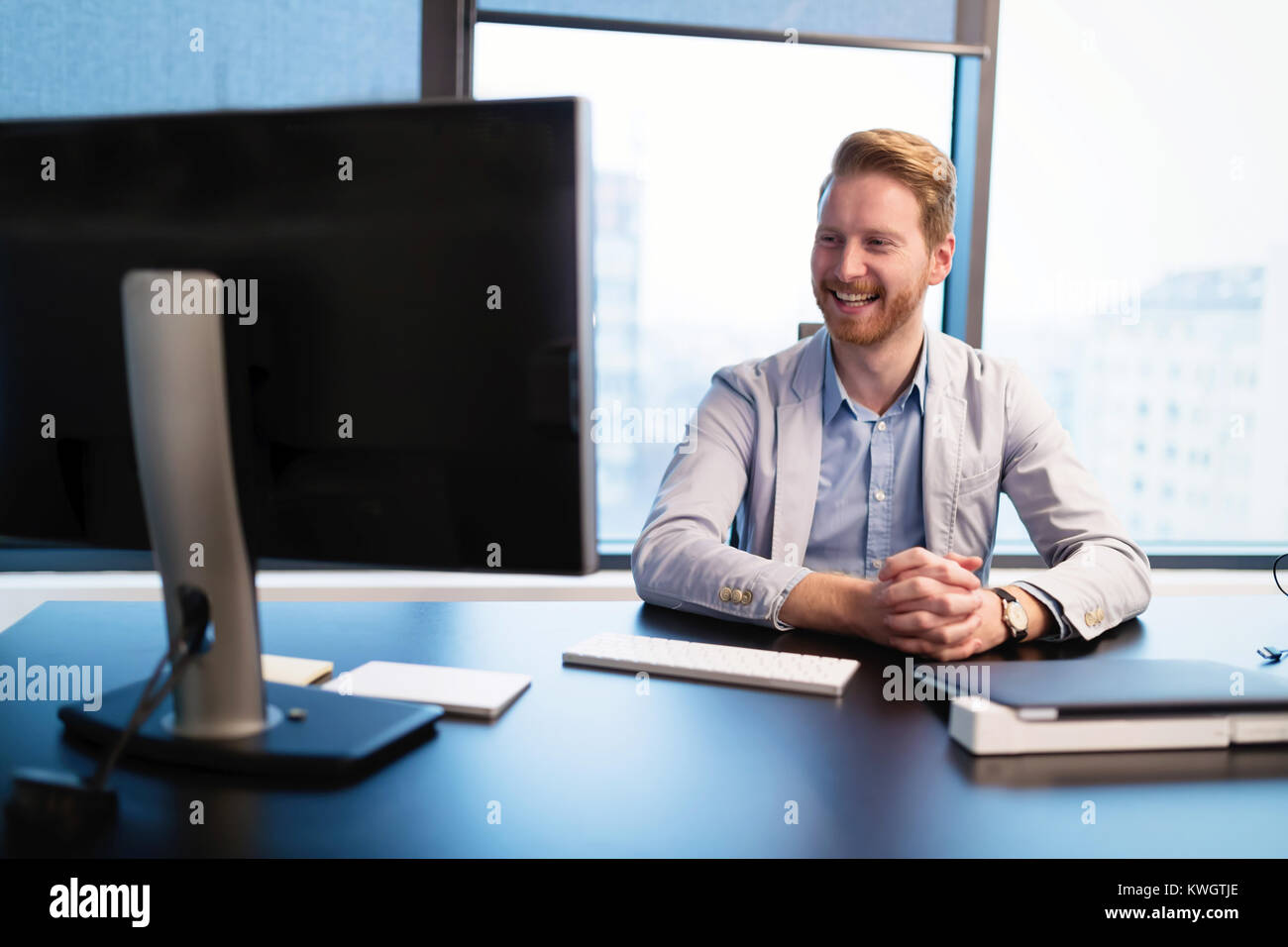 Portrait of happy business working in office Stock Photo - Alamy