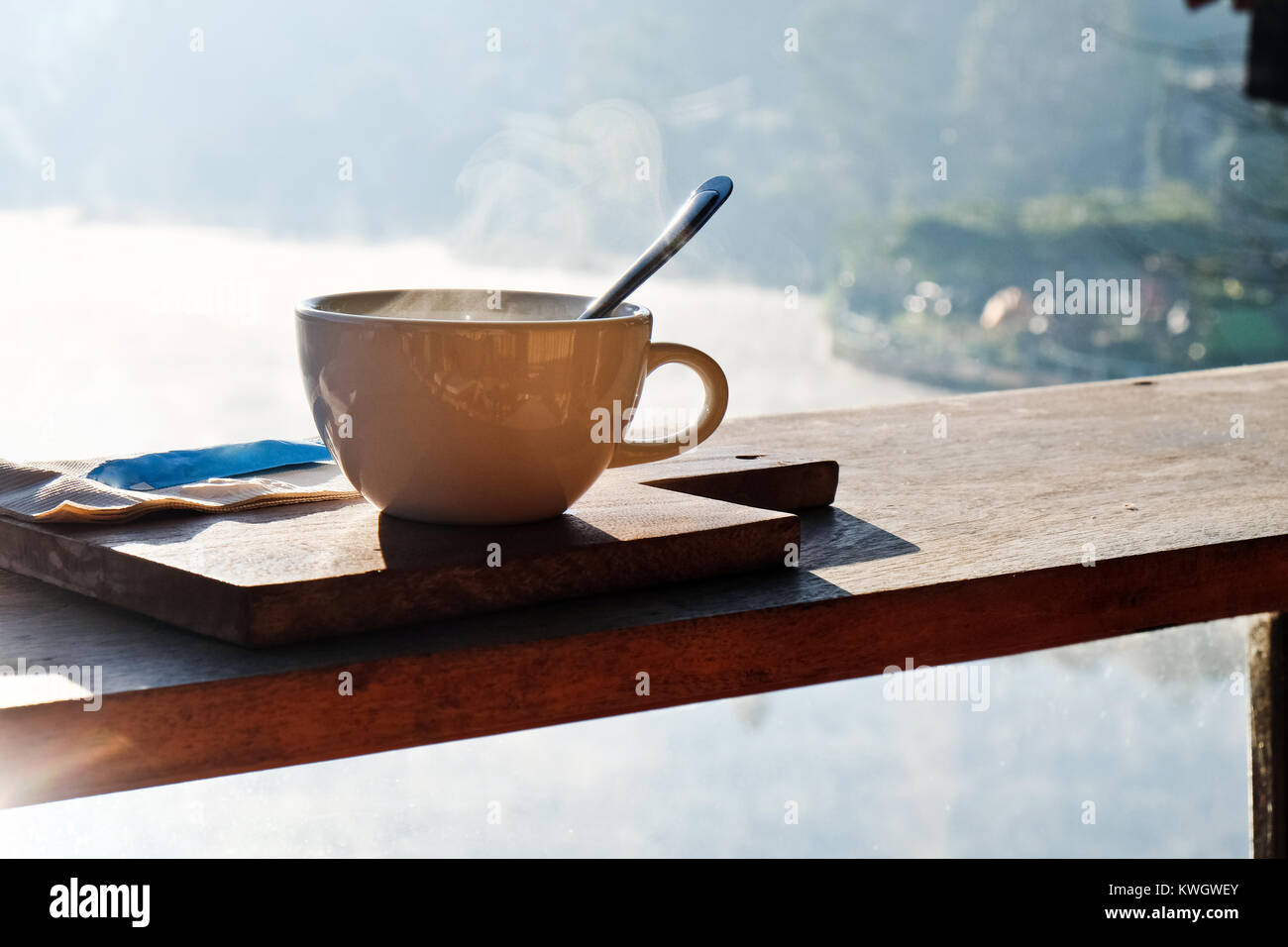 Cup of morning coffee with nature background Stock Photo - Alamy