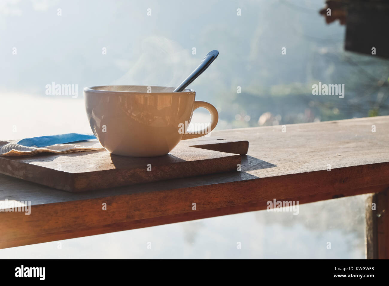 Cup of morning coffee with nature background Stock Photo - Alamy