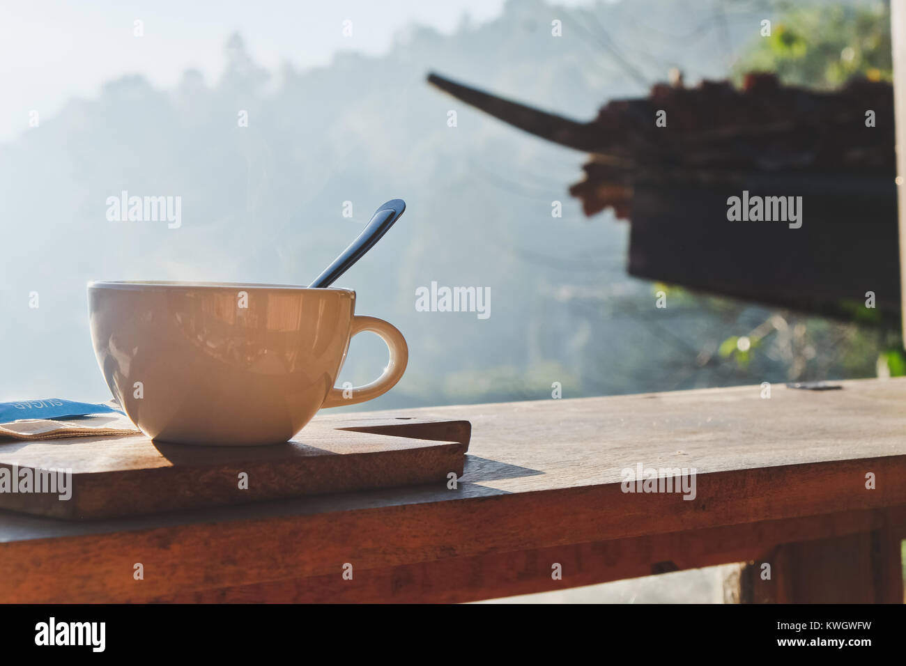Cup of morning coffee with nature background Stock Photo - Alamy