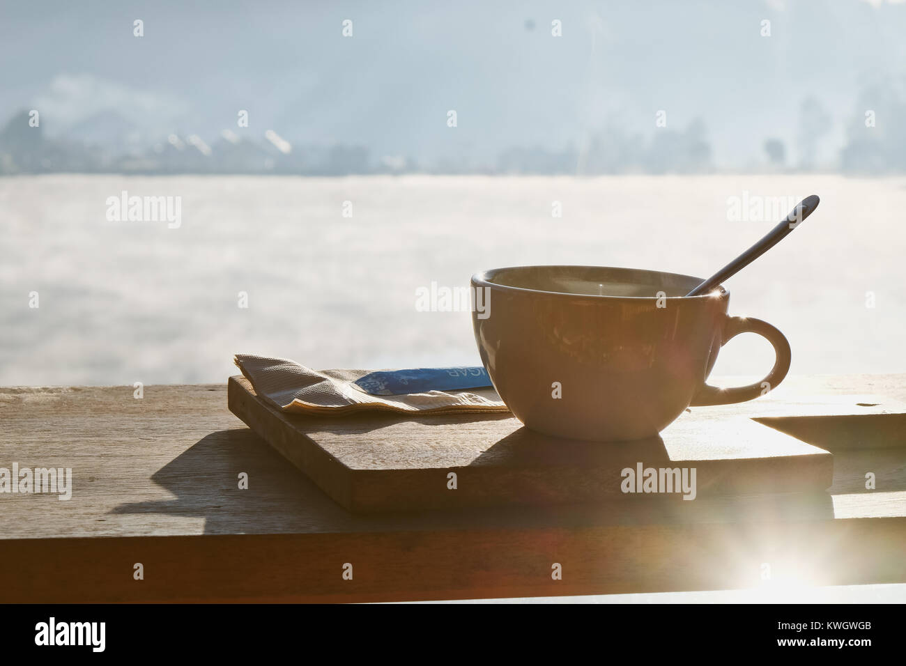 Cup of morning coffee with nature background Stock Photo - Alamy