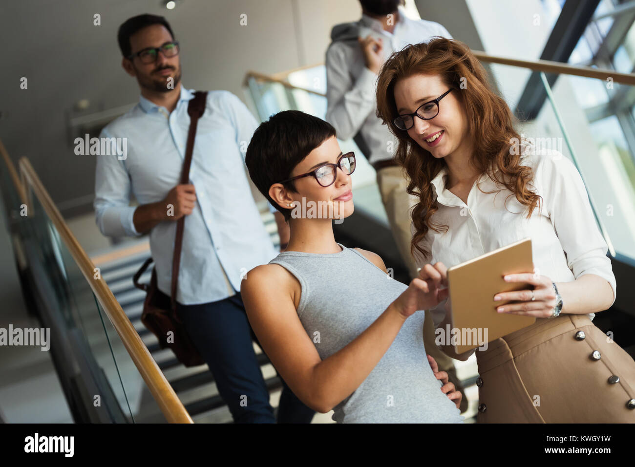 Happy business colleagues in modern office Stock Photo - Alamy