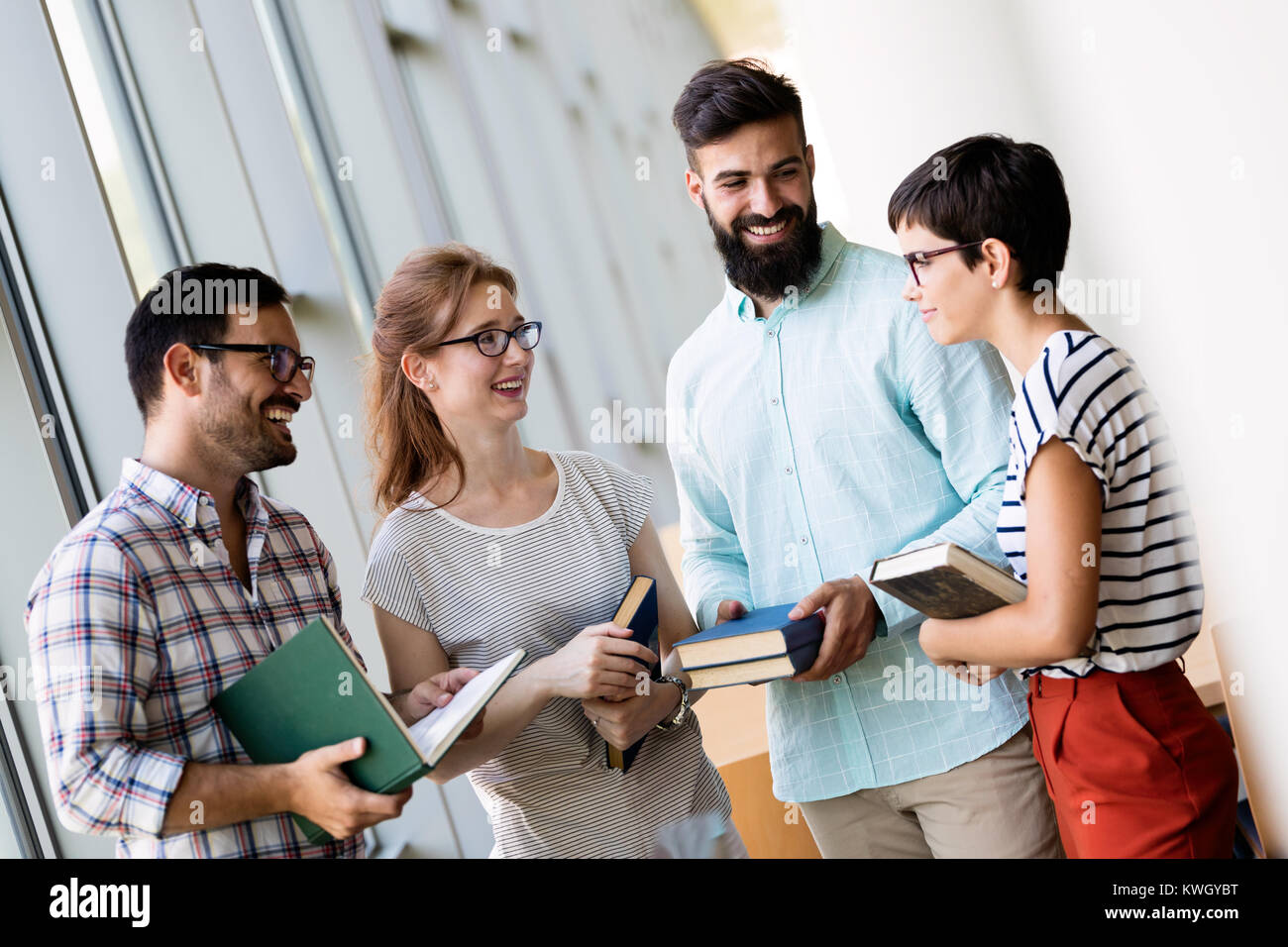 Group of college students working together in the ...