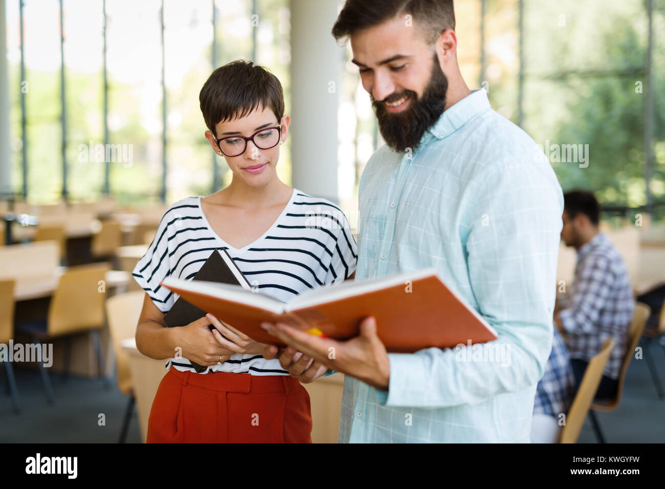 Young students studying in library Stock Photo - Alamy