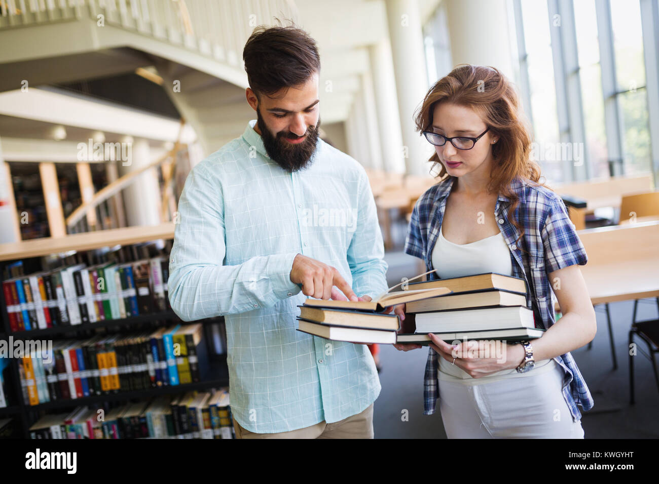 Group of college students at the library Stock Photo - Alamy