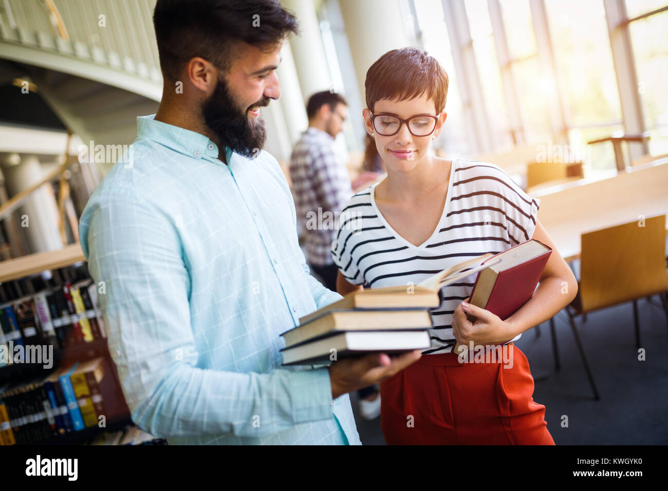 Young students studying in library Stock Photo - Alamy