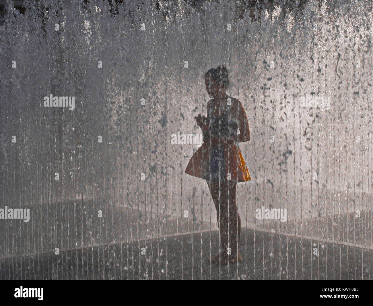 Girls trapped in water fountain Stock Photo - Alamy