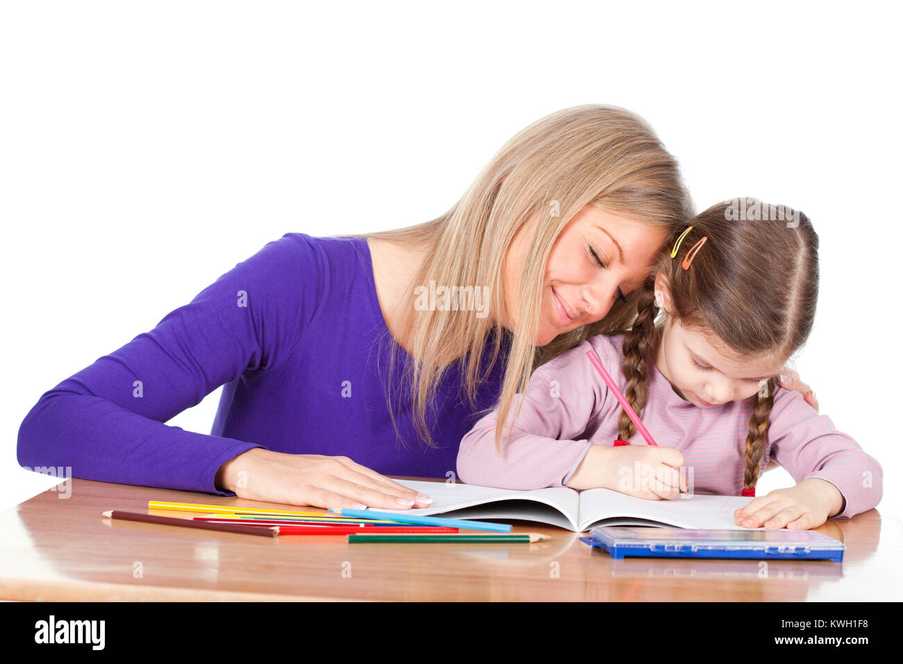 Mother and daughter are doing homework Stock Photo - Alamy