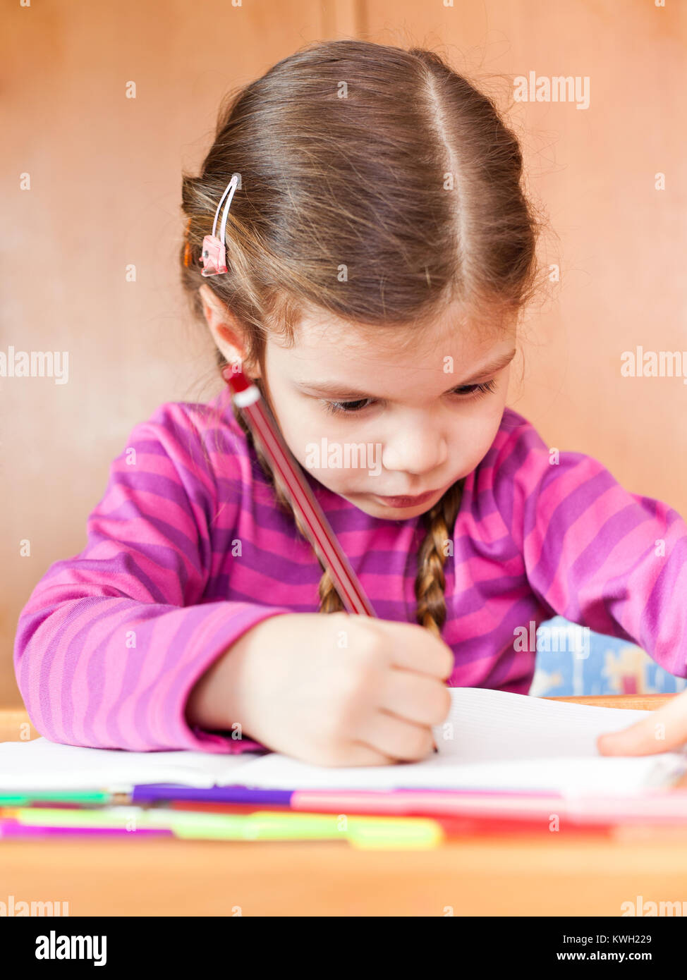 Preschooler child drawing in her room Stock Photo - Alamy