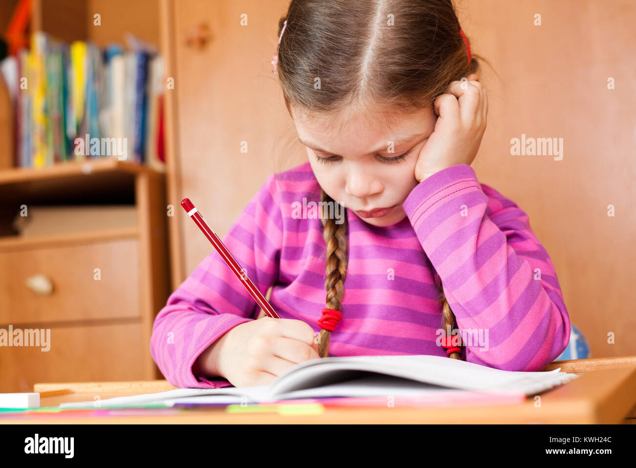 Preschooler child drawing in her room Stock Photo - Alamy