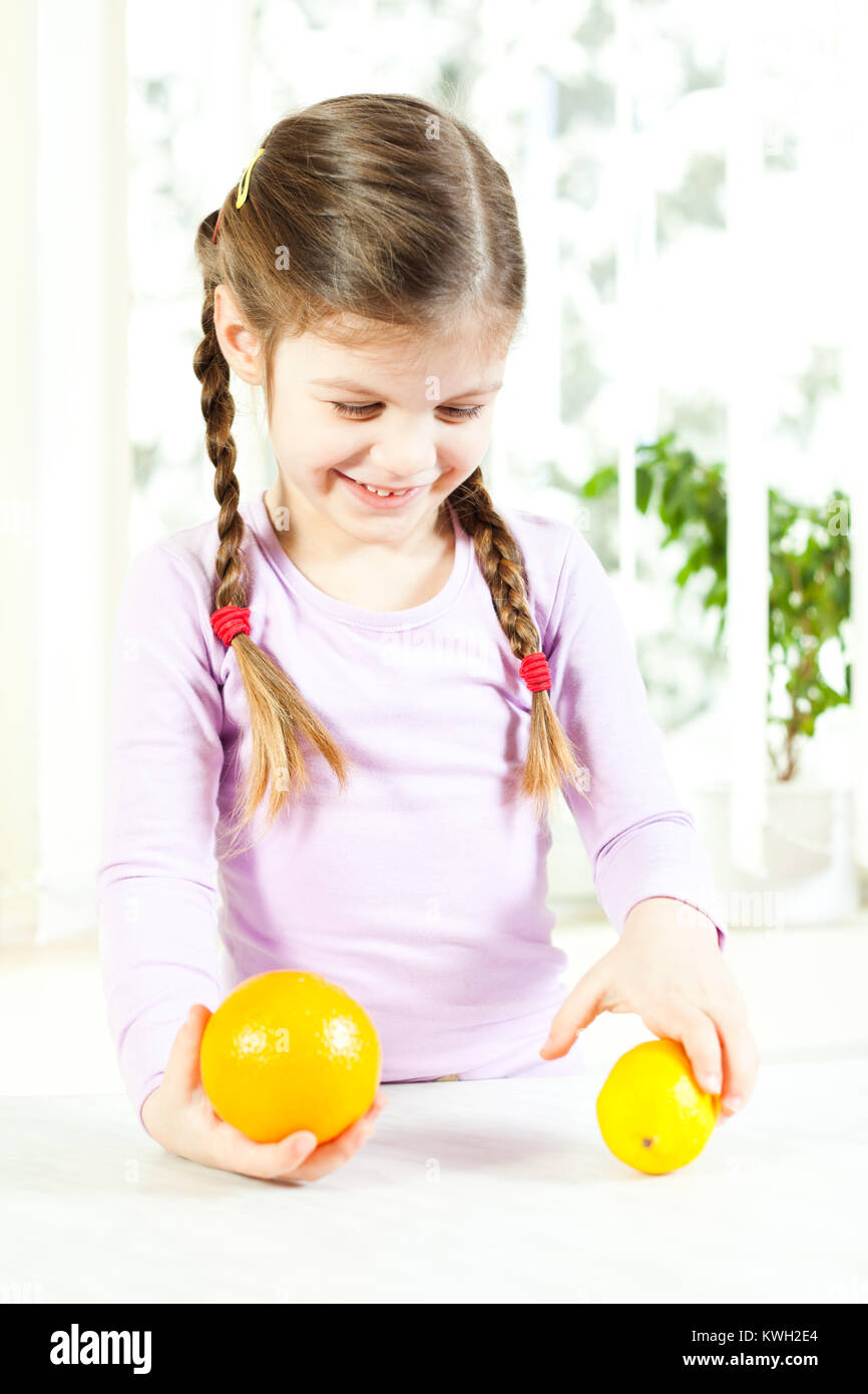 Happy child with fruit Stock Photo - Alamy