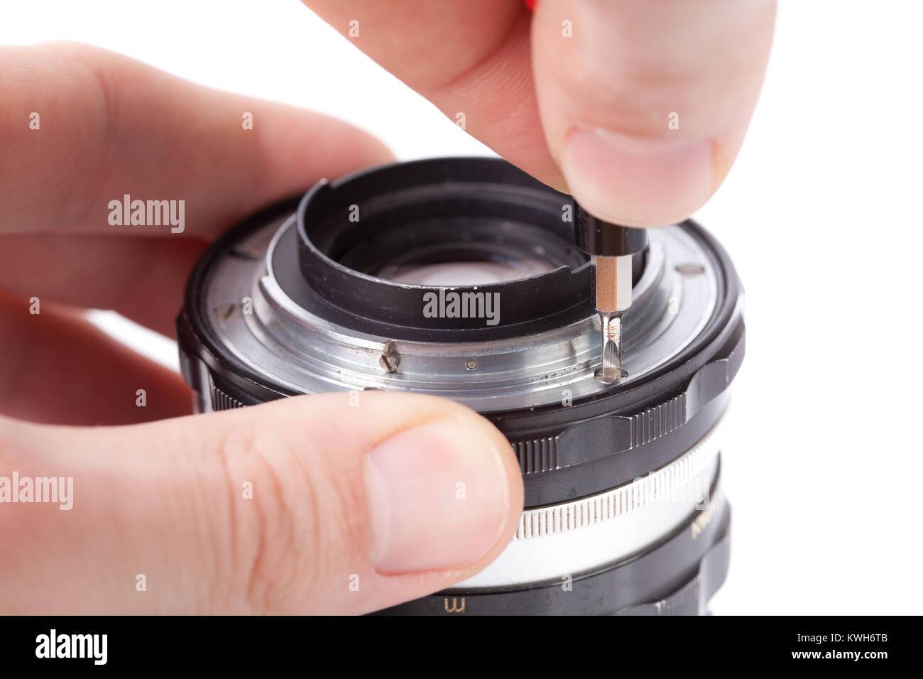 Technician repairing lens, removing lens mount Stock Photo - Alamy