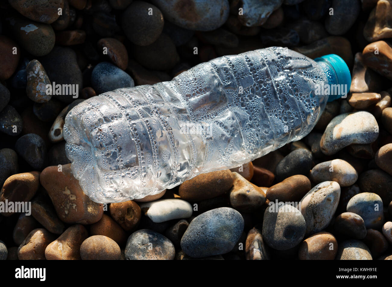 Plastic bottle washed up on a beach Stock Photo - Alamy