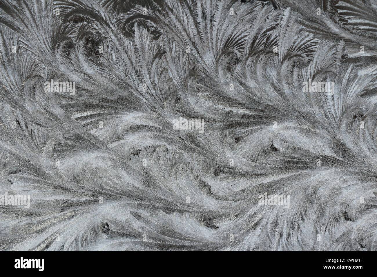Frozen ice patterns on window Stock Photo - Alamy
