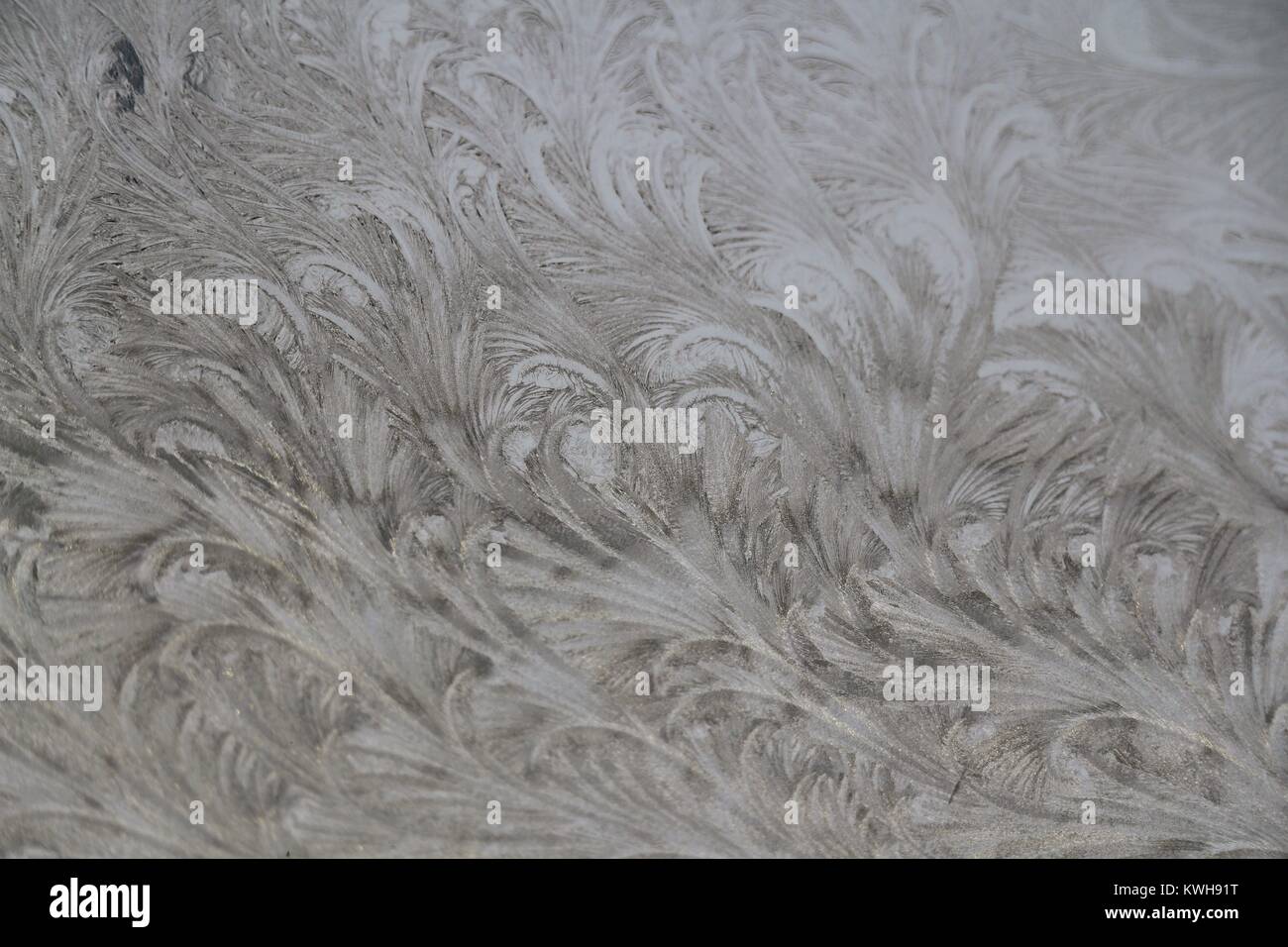 Frozen ice patterns on window Stock Photo - Alamy