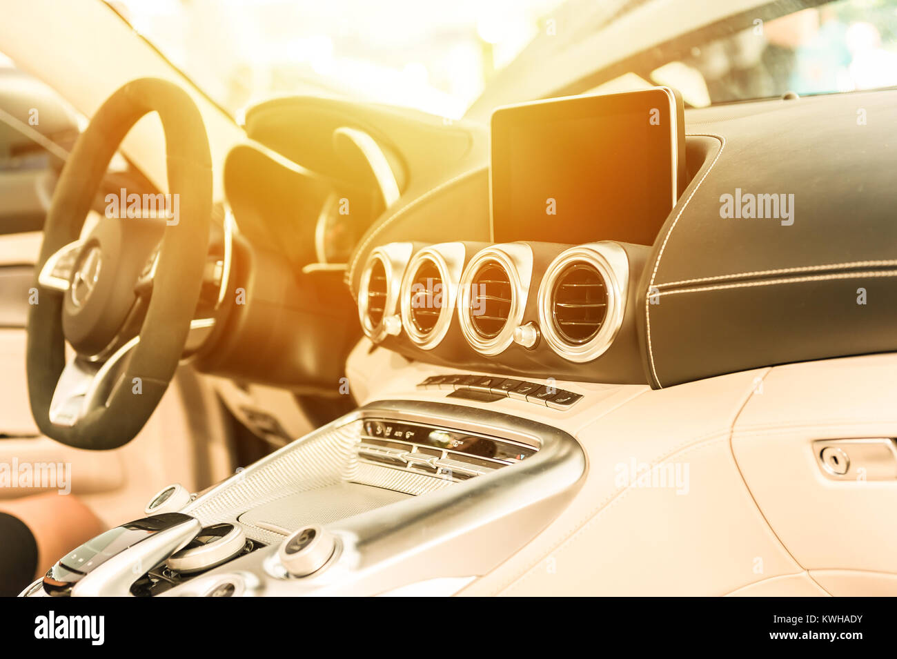 Modern car interior with sunlight in background Stock Photo - Alamy