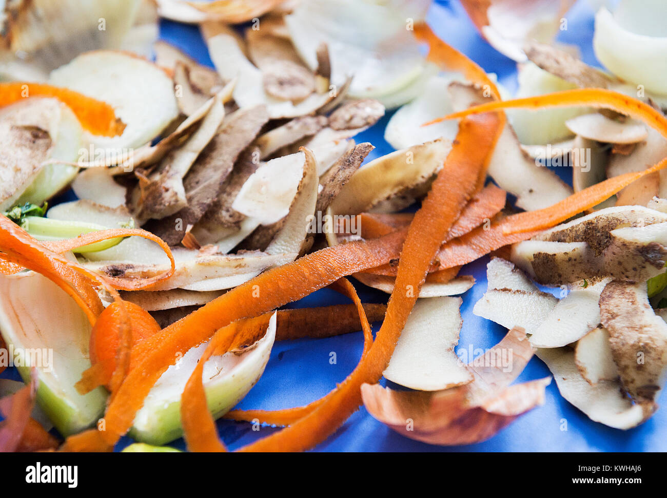 Vegetable peels are shown on a blue background Stock Photo - Alamy