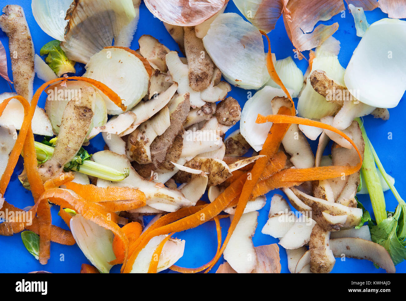 Vegetable peels are shown on a blue background Stock Photo - Alamy