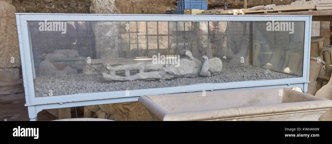 Pompeii mummified child in glass case Stock Photo - Alamy