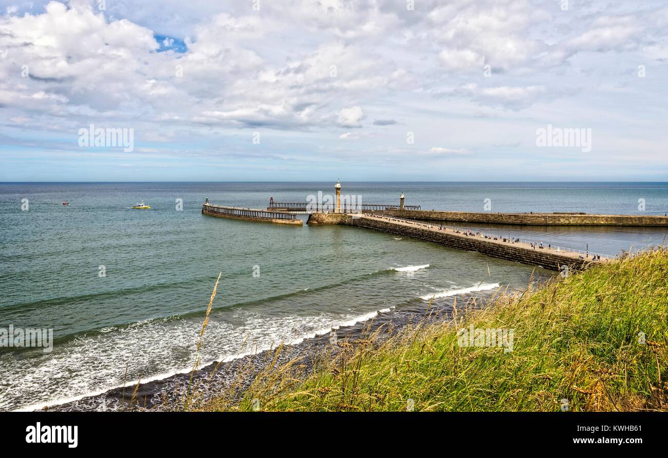 Two piers jutting out to sea at Whitby Stock Photo - Alamy