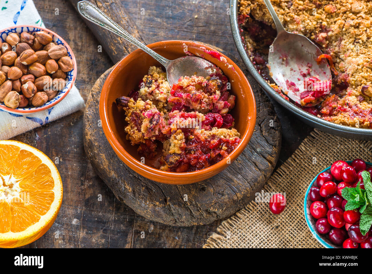 Cranberry, apple and hazelnut crumble - high angle view Stock Photo - Alamy