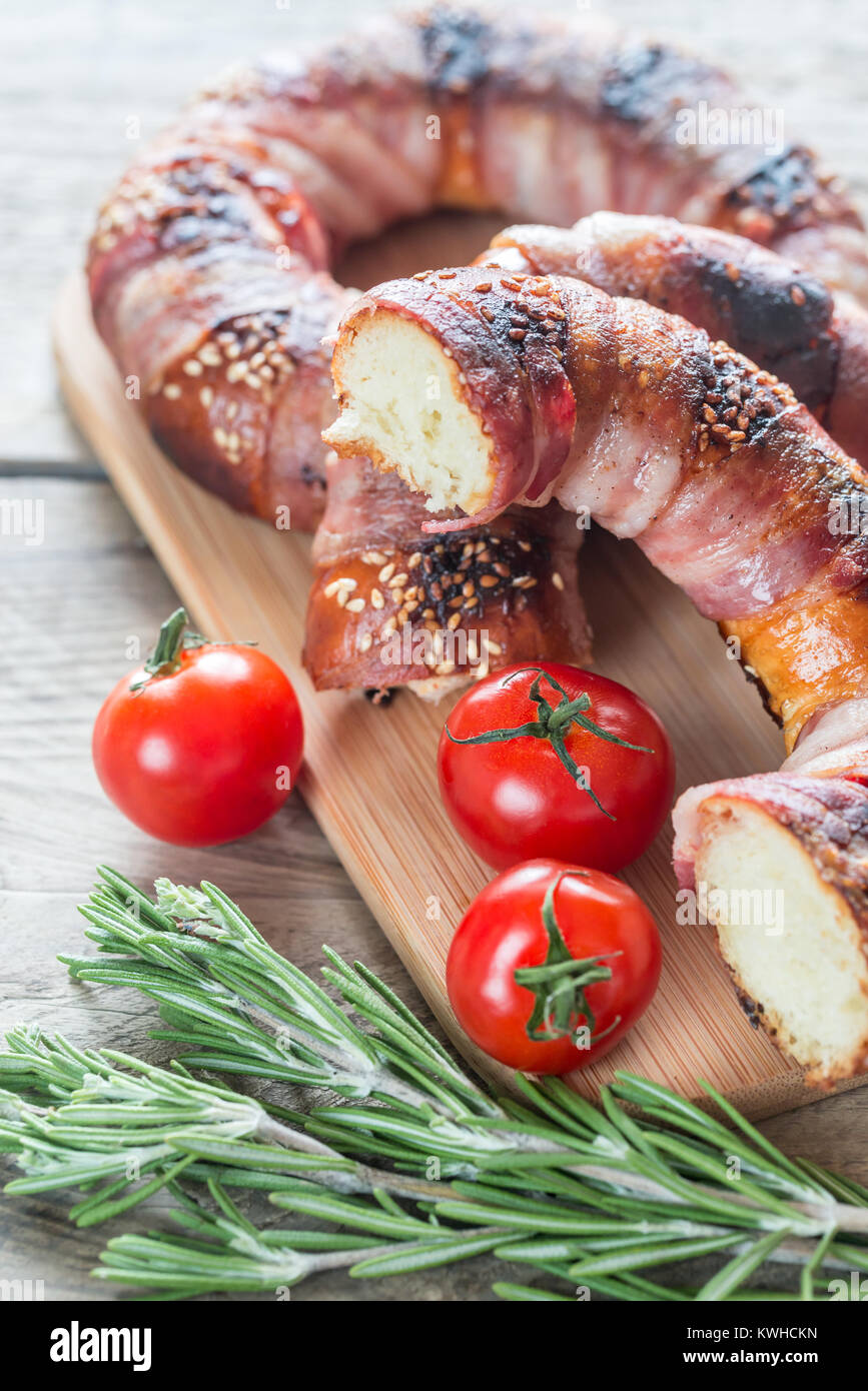 Bagels with sesame wrapped in bacon rashers Stock Photo - Alamy