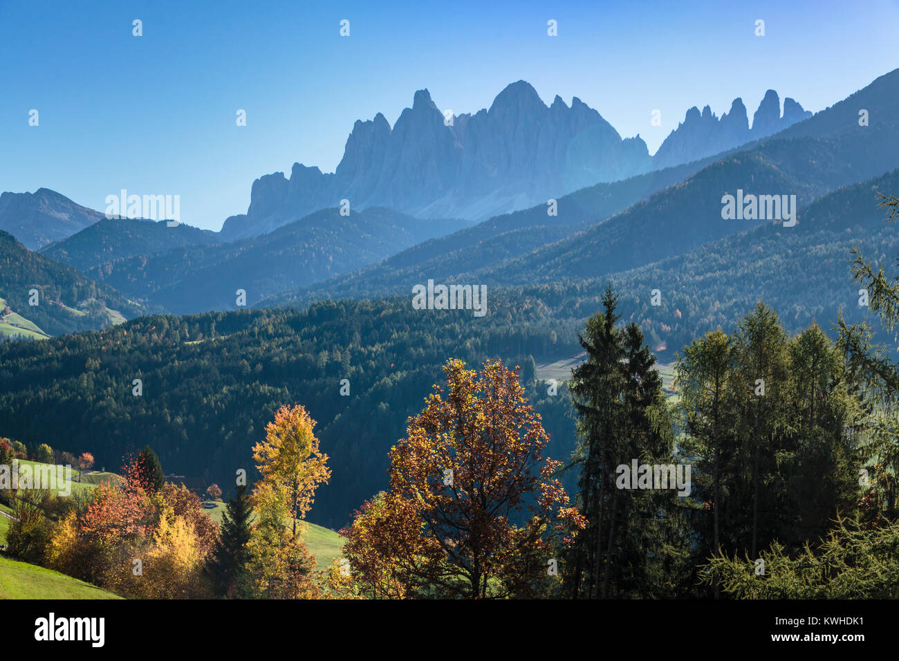 The Dolomite mountain range with fall foliage color near San Pietro ...