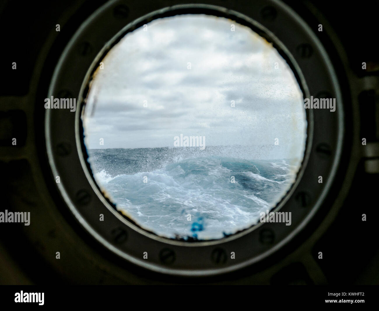 Ocean Adventurer ship port hole view of rough Drake Passage; Pasaje de ...