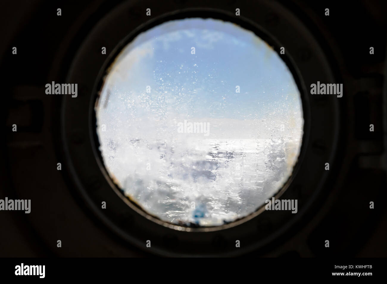 Ocean Adventurer ship port hole view of rough Drake Passage; Pasaje de ...